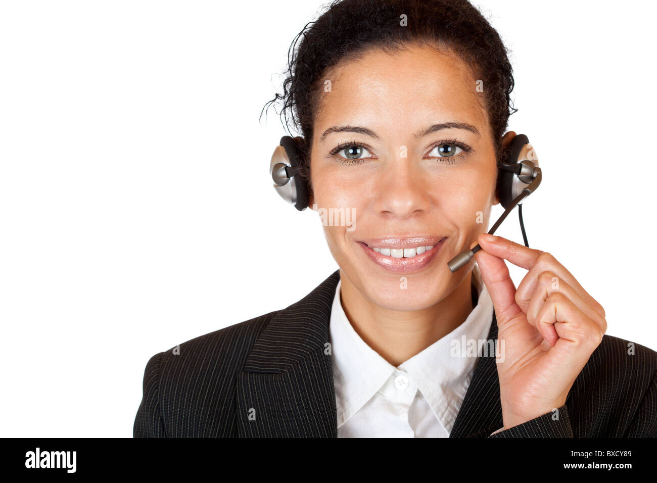 Smiling attractive woman makes with headset a call. Isolated on white ...