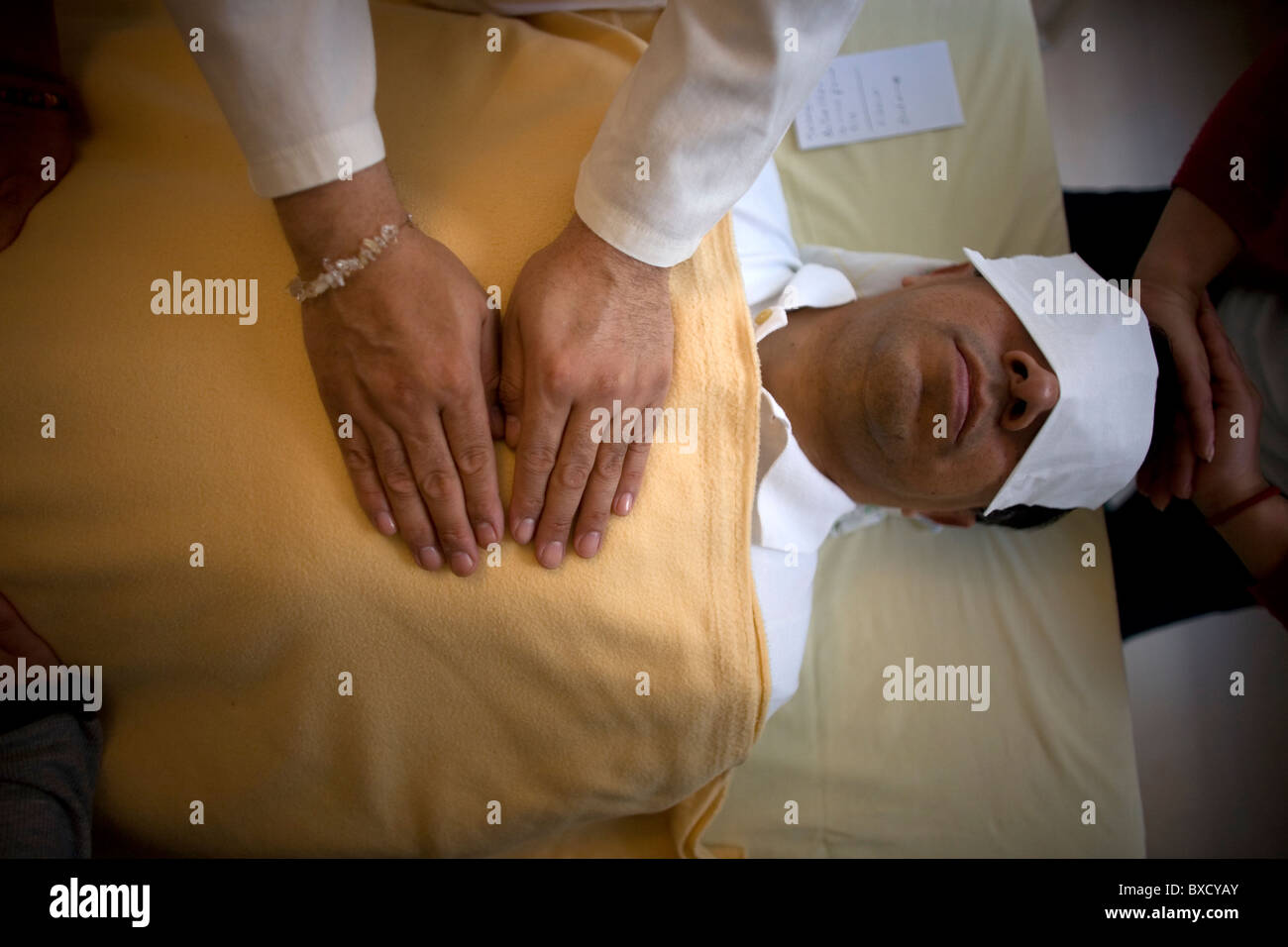 A man receives Reiki in Mexico City Stock Photo - Alamy