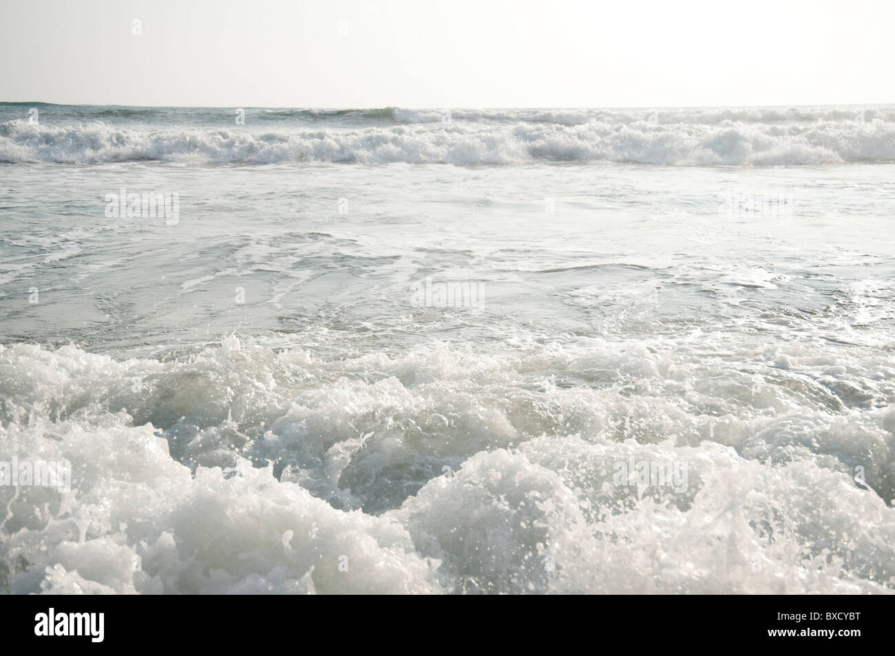 rolling ocean waves parallel to the horizon on an overcast day Stock ...
