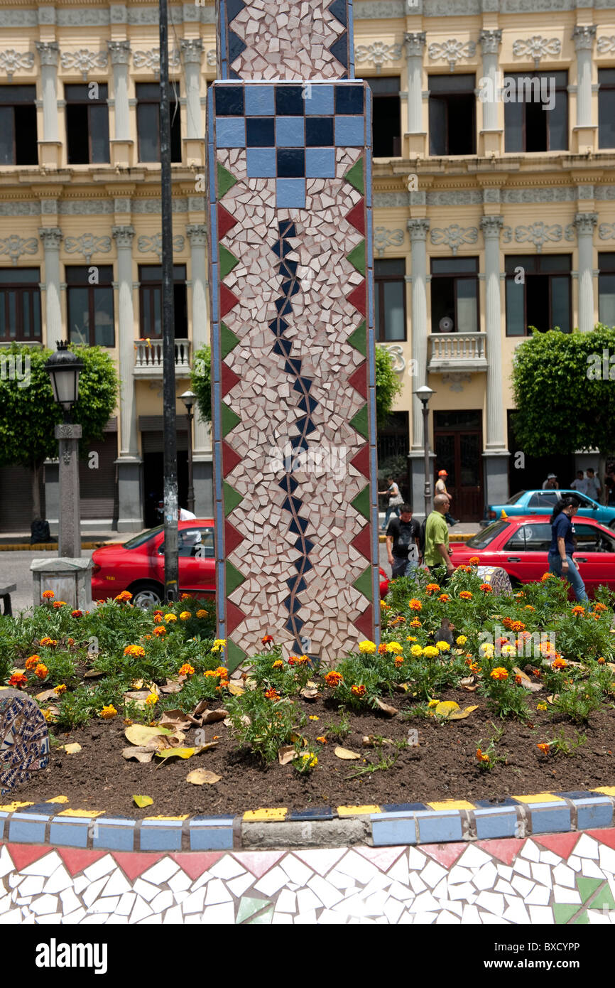 Mosaic tile snake rising from a flower garden Stock Photo - Alamy