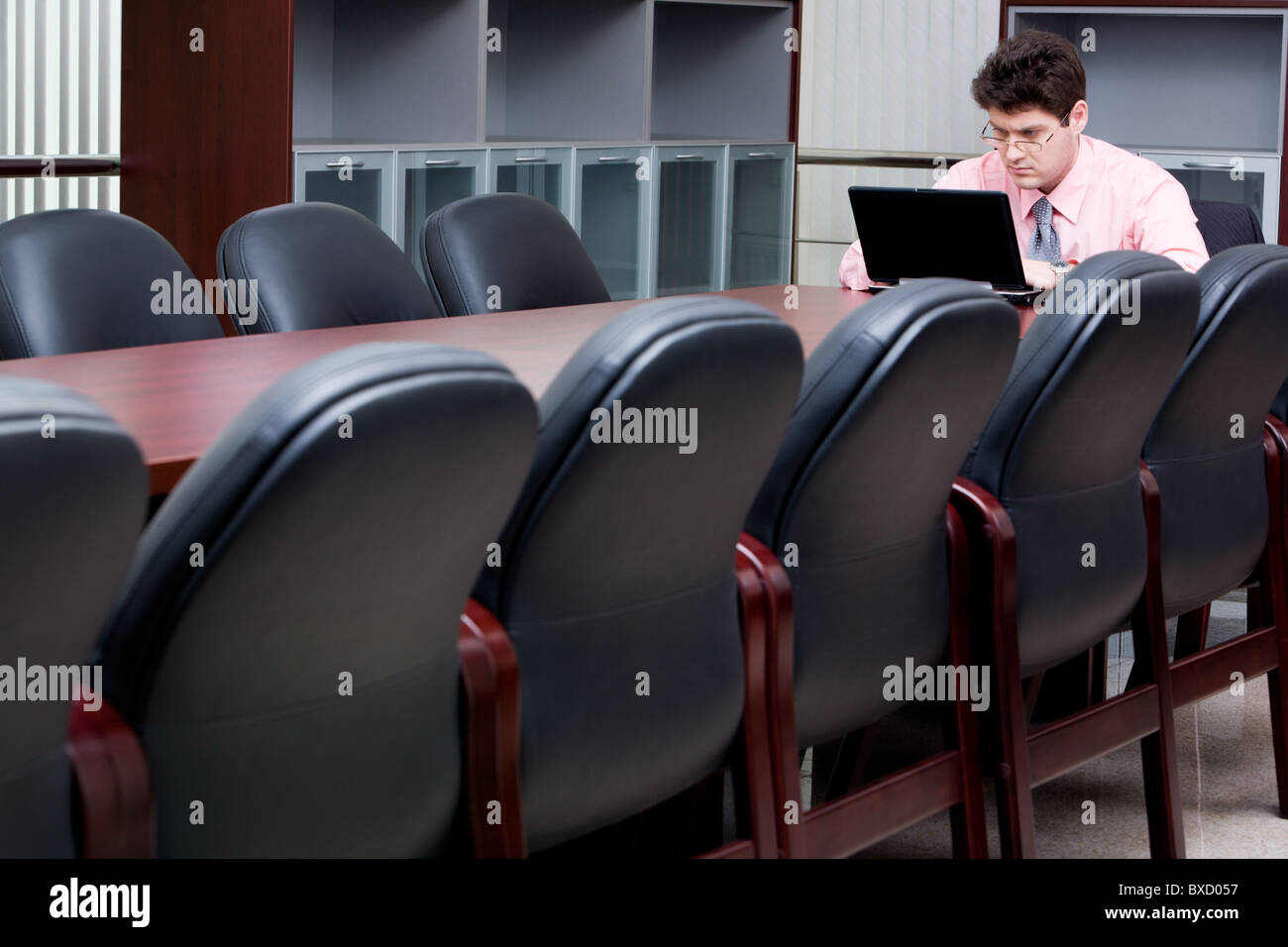 Portrait of serious boss working in the boardroom Stock Photo - Alamy