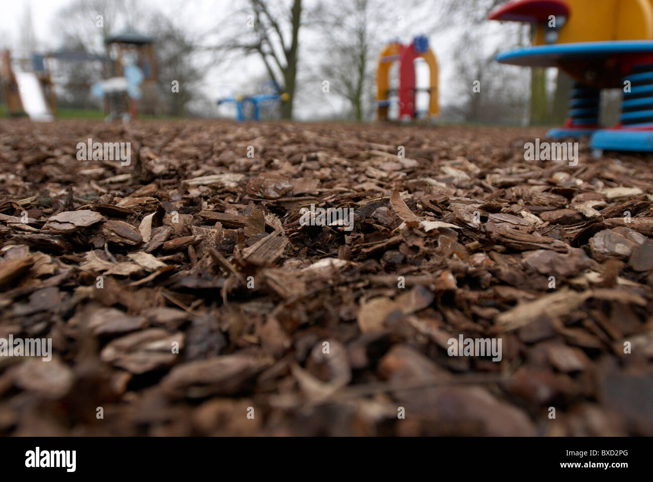Playground surfacing with bark-based pine chipboards made of recycled ...