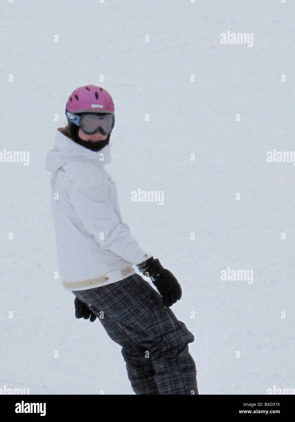 Teenage girl snowboarding on a ski slope in Vail, Colorado Stock Photo ...