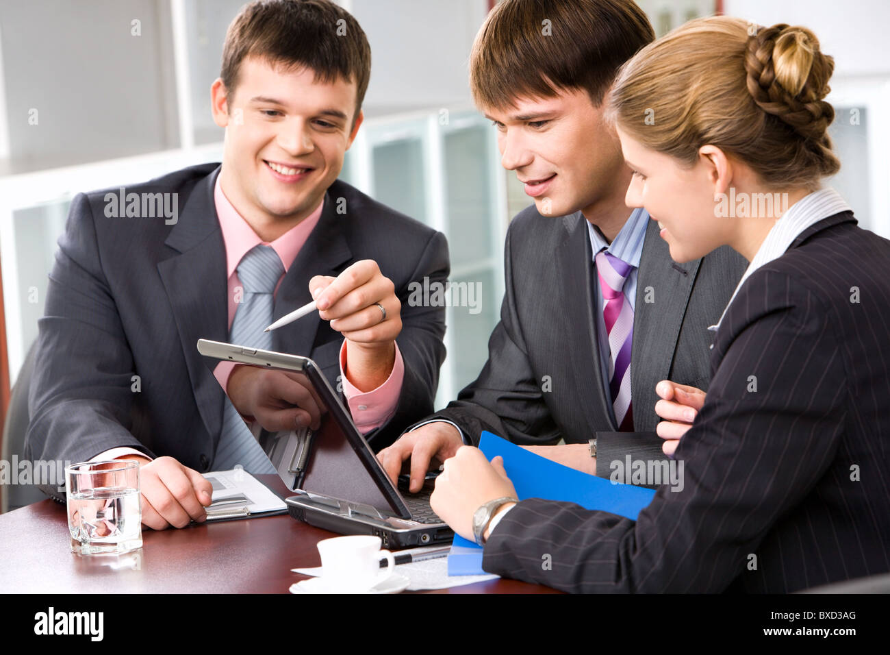 Confident manager is explaining the correct way of analysis to his ...