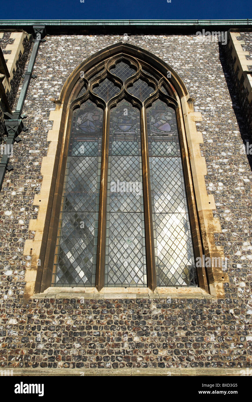 A stained glass window on the perpendicular Gothic style medieval ...