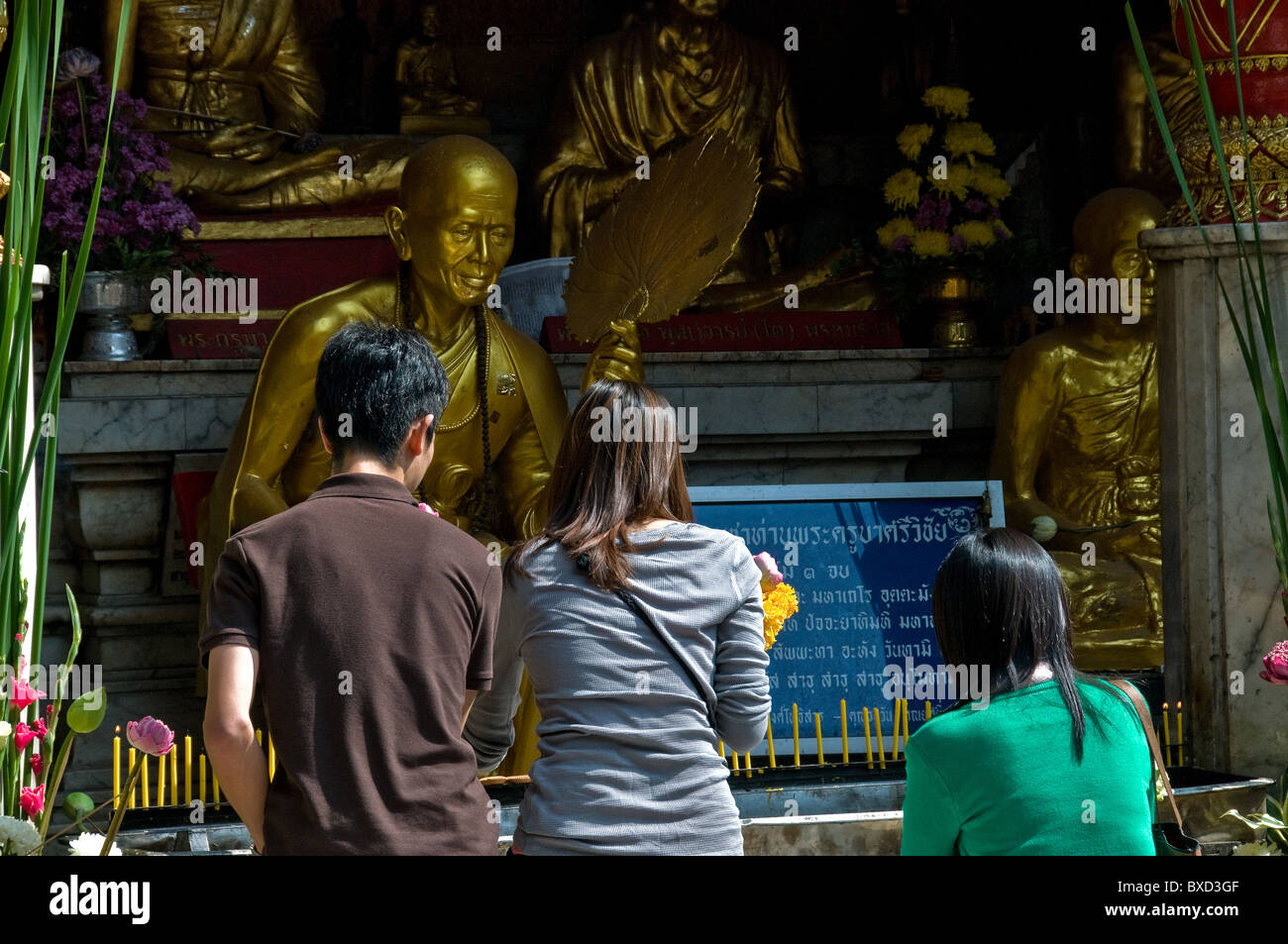 Shrine figure gold worshippers worshipping praying religion hi-res ...