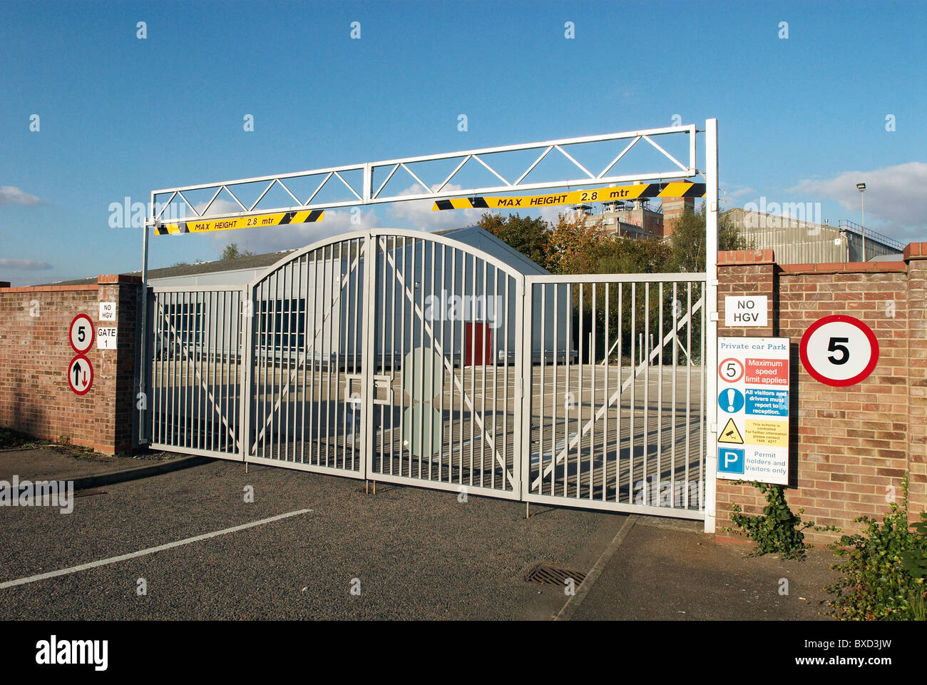 Barrier gate at with a height restriction at an entrance to a factory ...