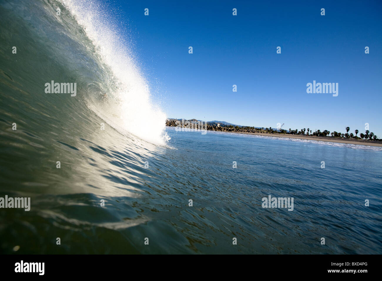 A large wave barrels Stock Photo - Alamy