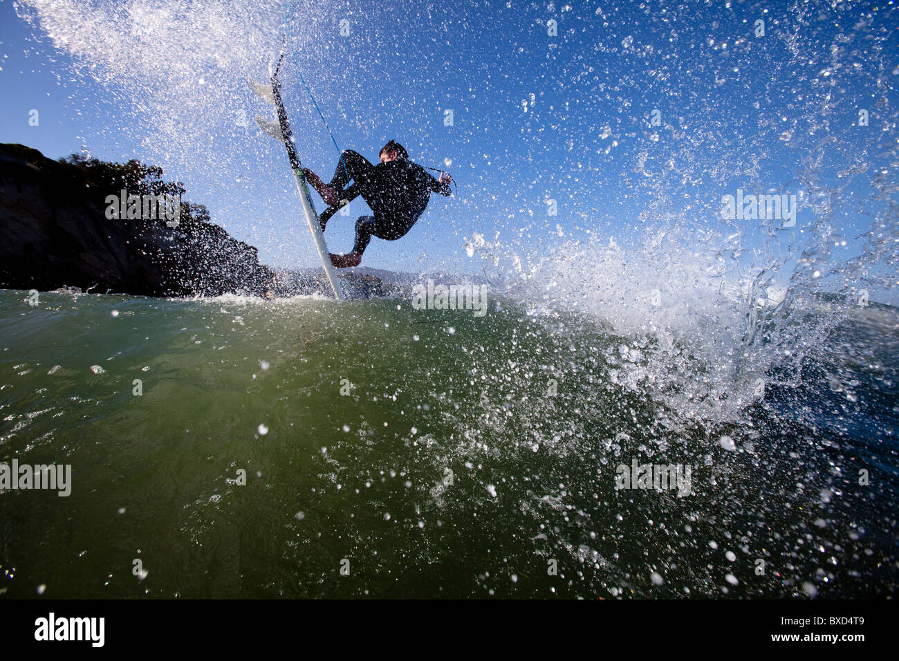 A skilled male surfer launches an air Stock Photo - Alamy