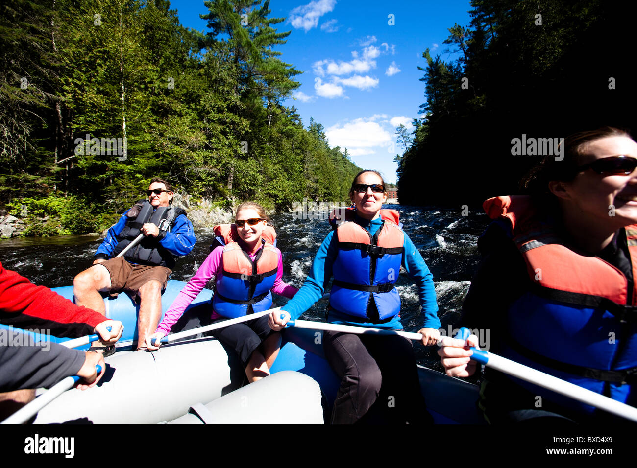 A group of adults whitewater rafting in Maine Stock Photo - Alamy