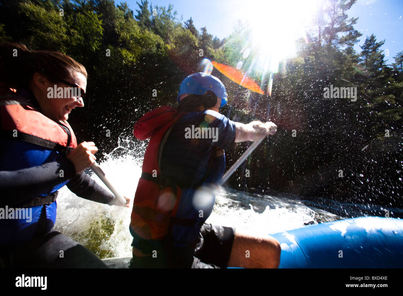 A group of adults whitewater rafting in Maine Stock Photo - Alamy