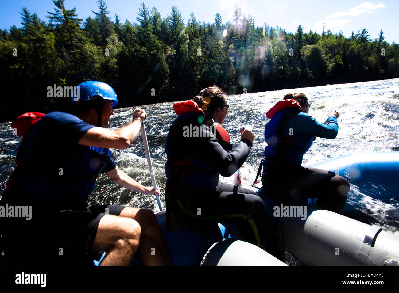 A group of adults whitewater rafting in Maine Stock Photo - Alamy