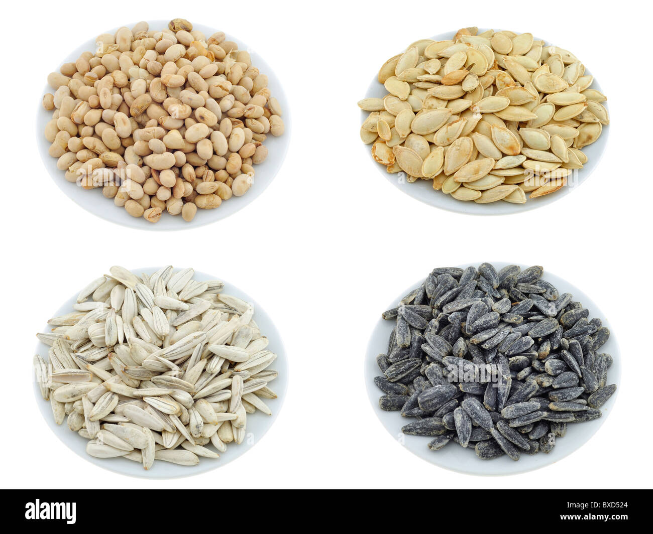 Nuts, Seeds & Appetizers on white plate Stock Photo - Alamy