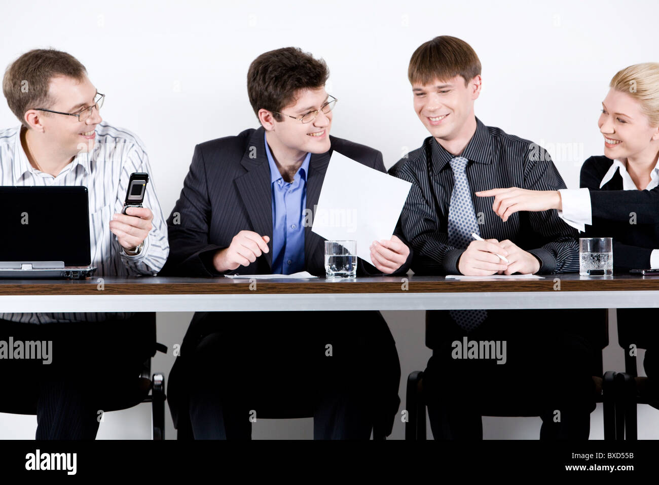 Four entrepreneurs sitting table hi-res stock photography and images ...