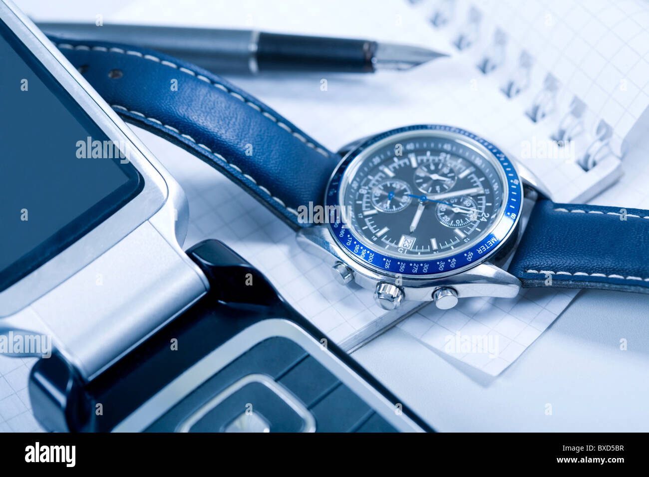 Creative photo: telephone, wrist-watch, notepad and fountain-pen Stock ...