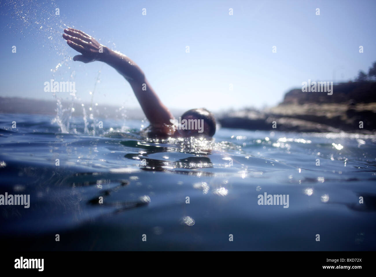 Male swimmer swimming at the ocean Stock Photo - Alamy