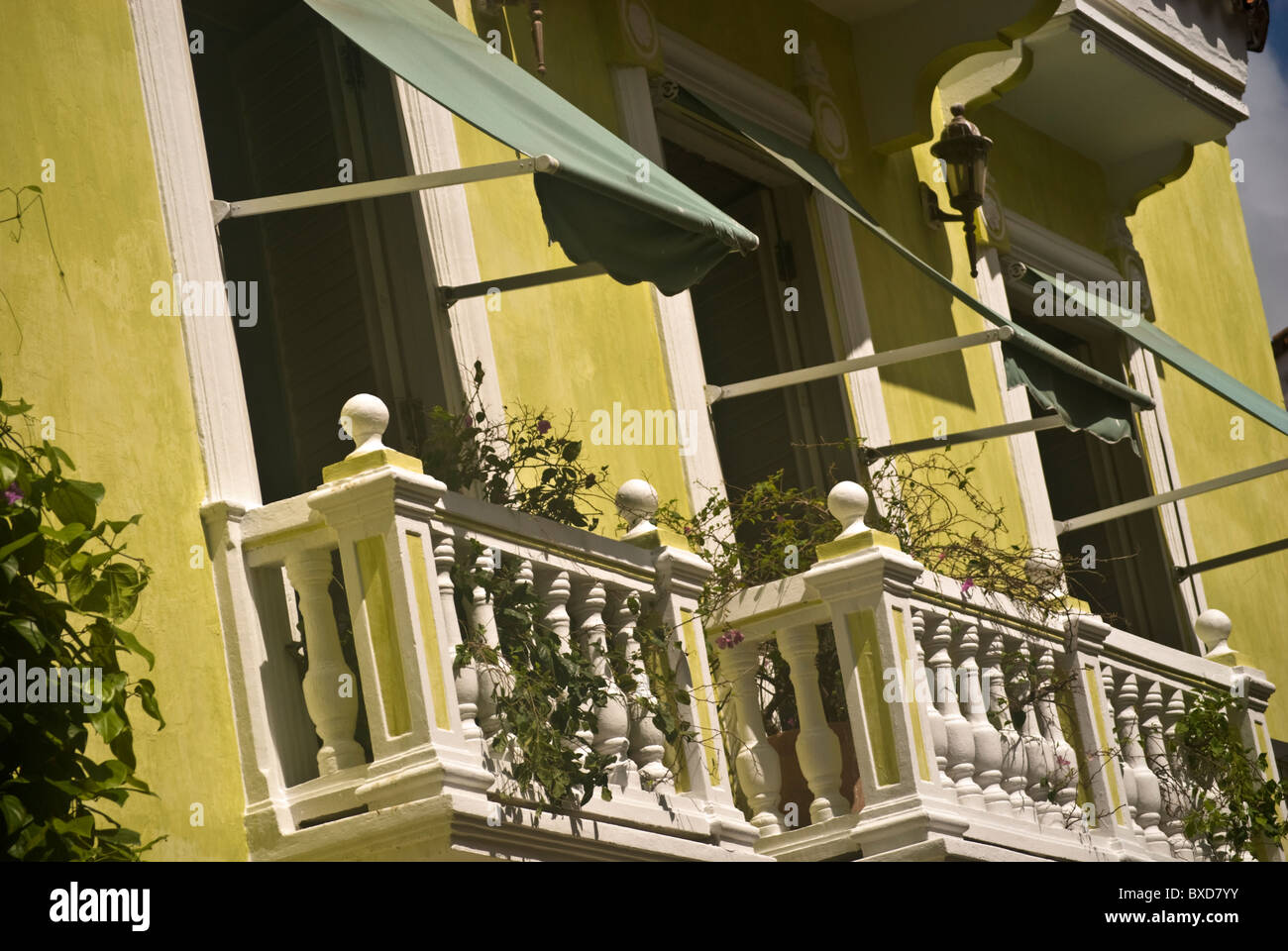 Balconies draped with flowers in the centre of the Old Town, Colombia ...
