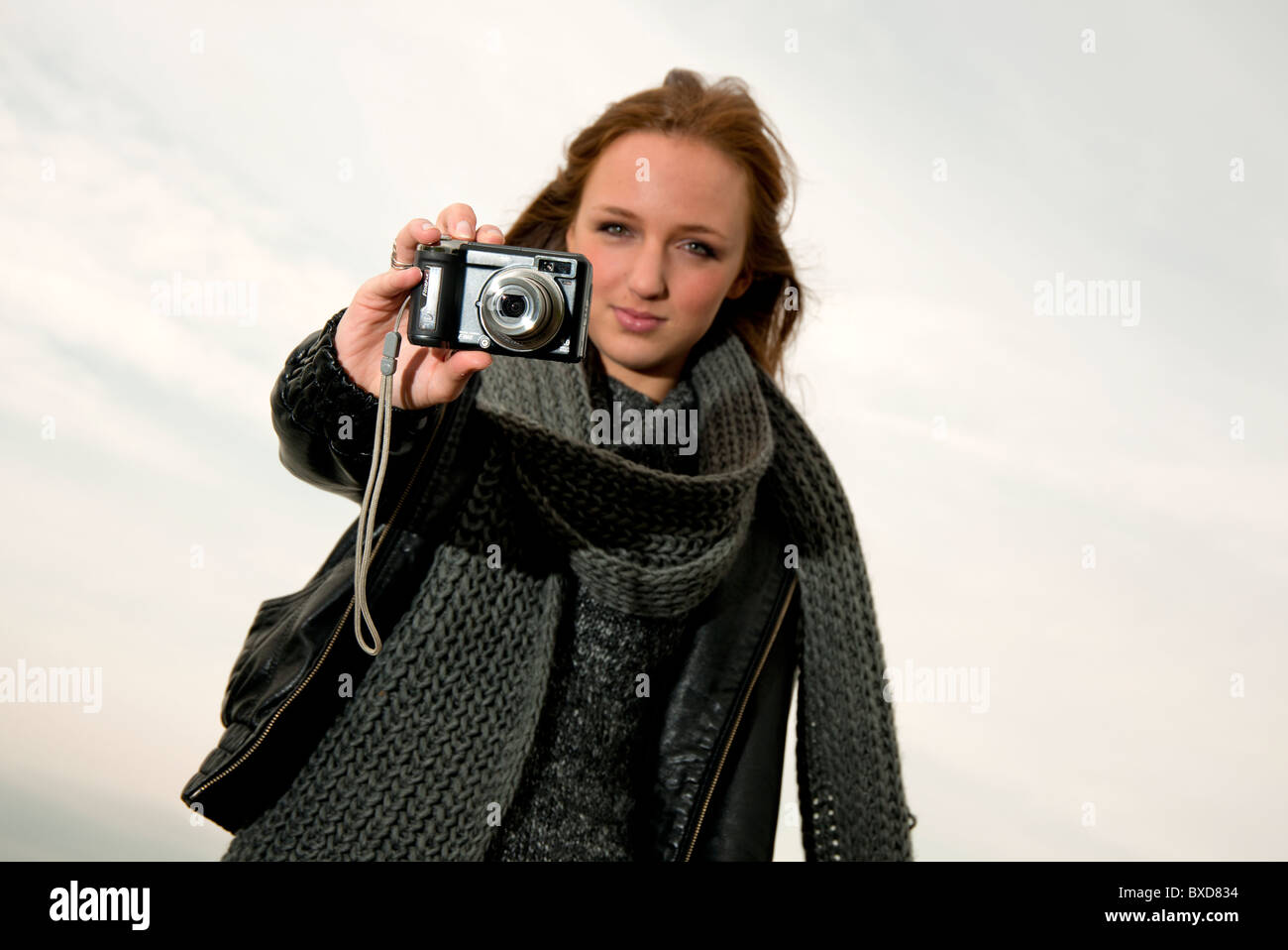 young woman taking a photo with digital camera Stock Photo - Alamy