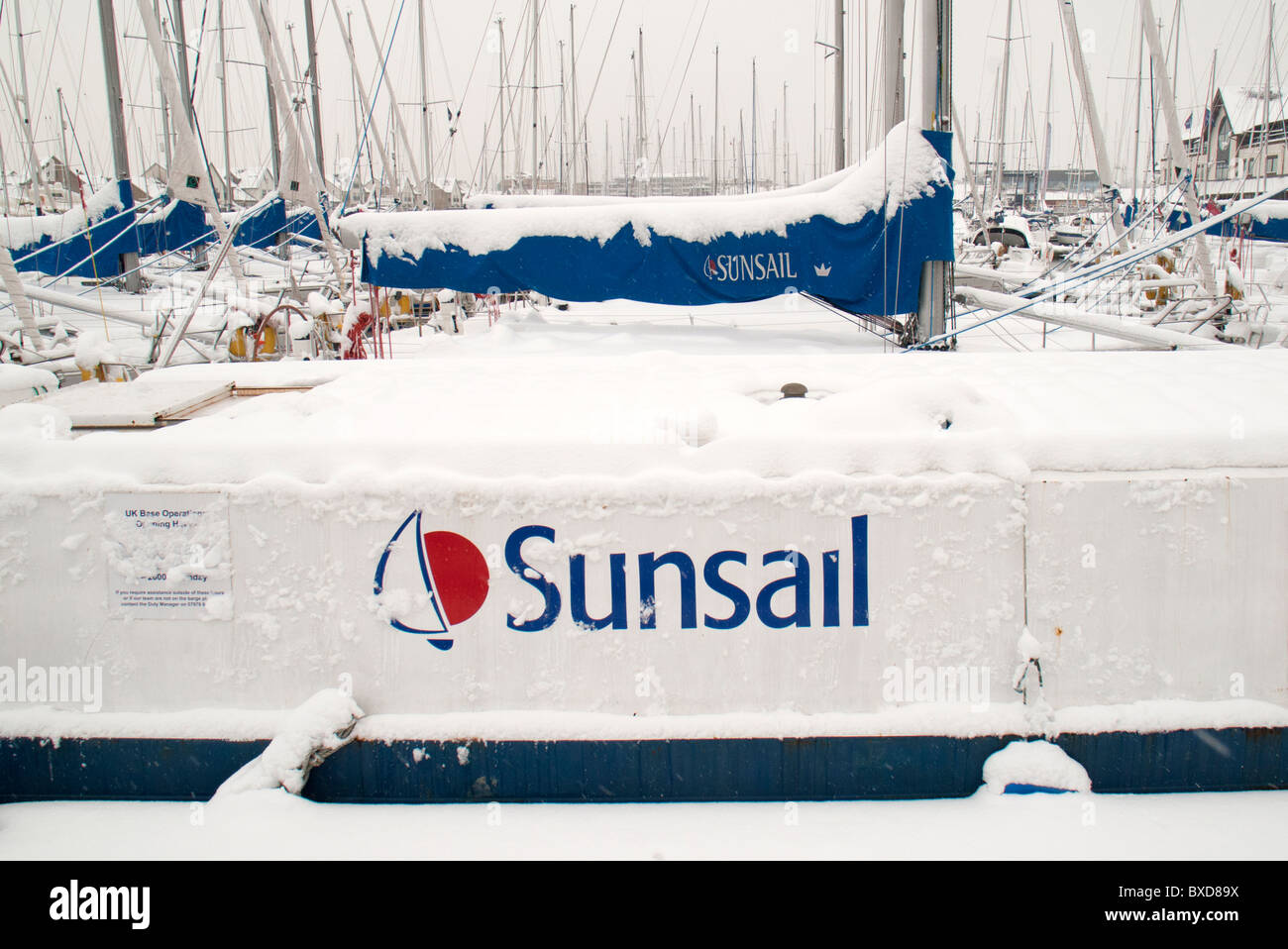 Sunsail yachts covered in snow in Port Solent Marina Stock Photo - Alamy