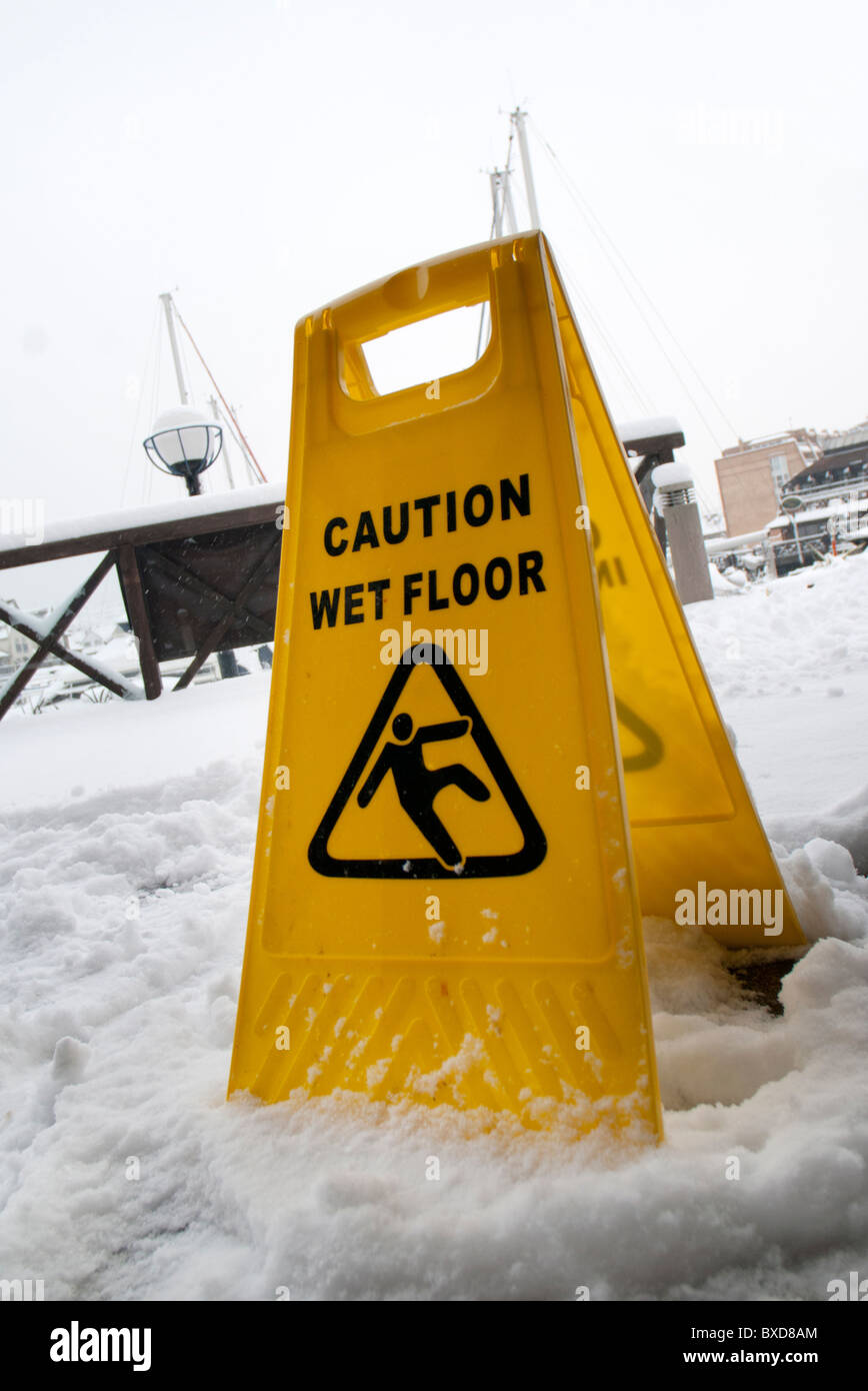 Caution slippery surface cone sign hi-res stock photography and images ...
