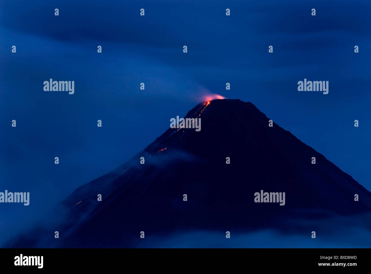 Arenal volcano by night in Costa Rica Stock Photo - Alamy