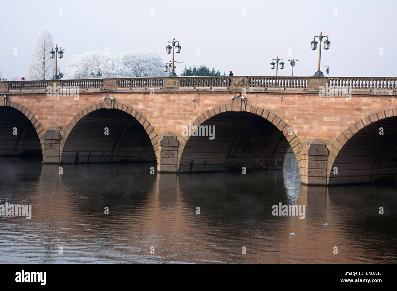 River Severn bridge at Worcester with frost covered trees. England ...