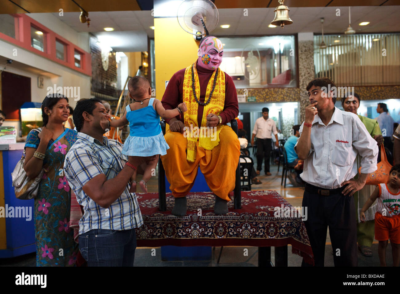 A family at the entrance to Chotiwala restaurant in Rishikesh ...
