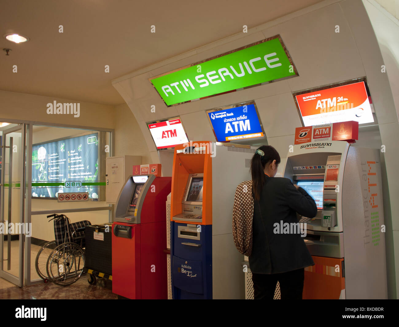 Women using an ATM machine at the ATM Service center area in MBK ...