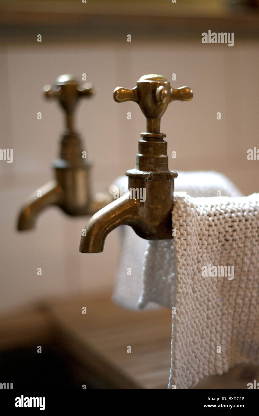 A pair of copper kitchen taps Stock Photo - Alamy