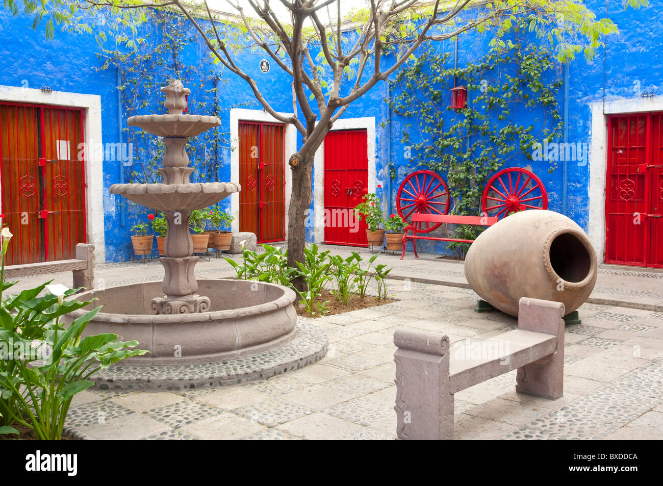 Colorful courtyard with red doors and blue walls in Arequipa, Peru ...