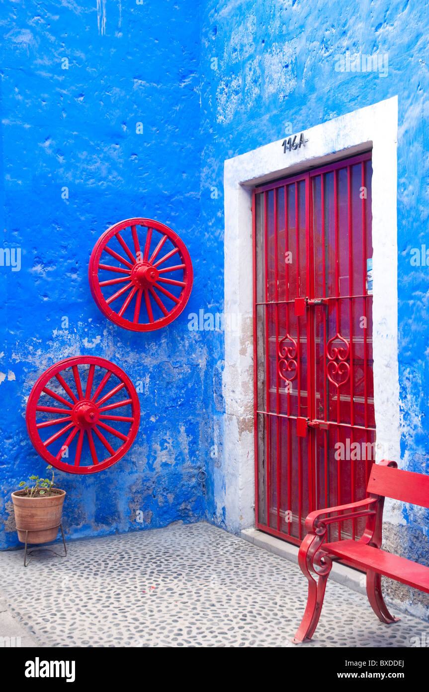 Colorful courtyard with red doors and blue walls in Arequipa, Peru ...