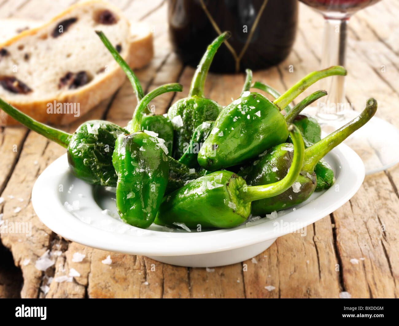 Whole griddled Padron peppers snack with sea salt Stock Photo - Alamy