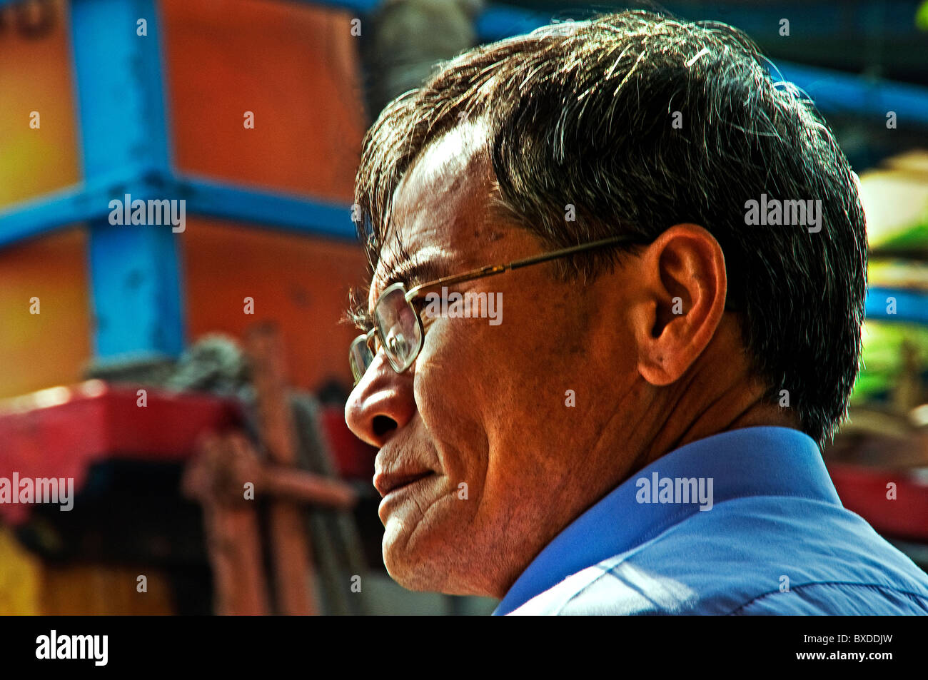 Asian man sitting on park bench in Hong Kong China Stock Photo - Alamy