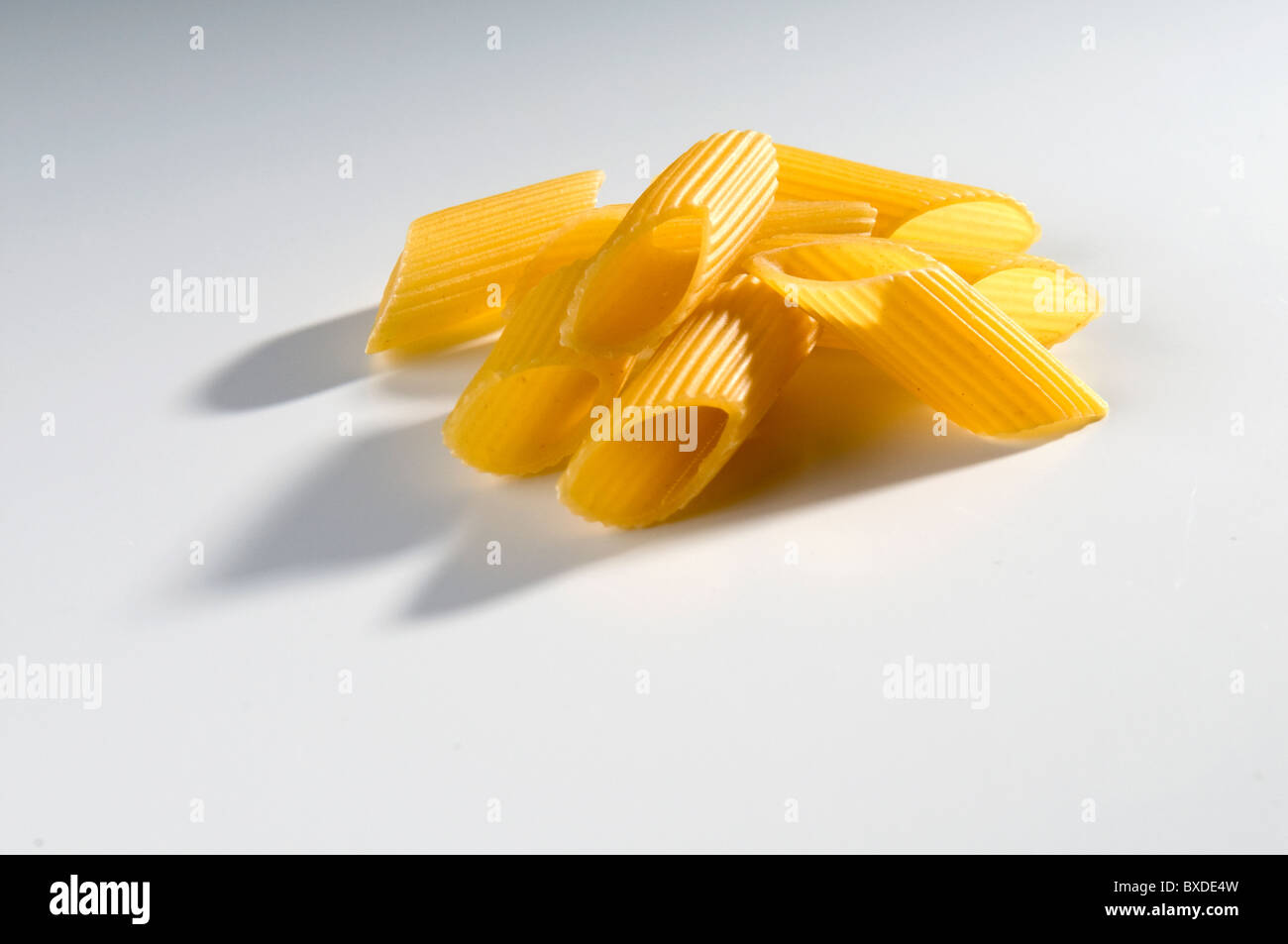 Uncooked penne rigate Stock Photo - Alamy