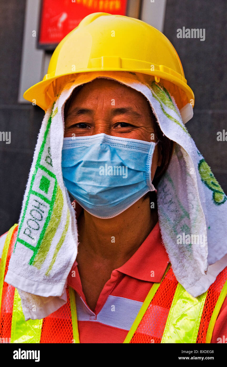 Female construction worker working in Hong Kong China Stock Photo - Alamy