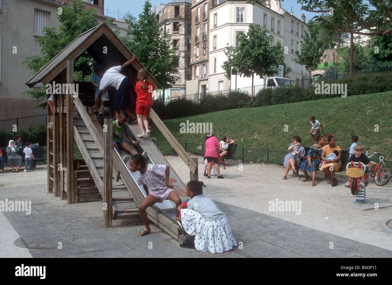FRANCE. CHILDREN FROM MULTIETHNIC BACKGROUNDS AT A PLAYGROUND IN PARIS ...