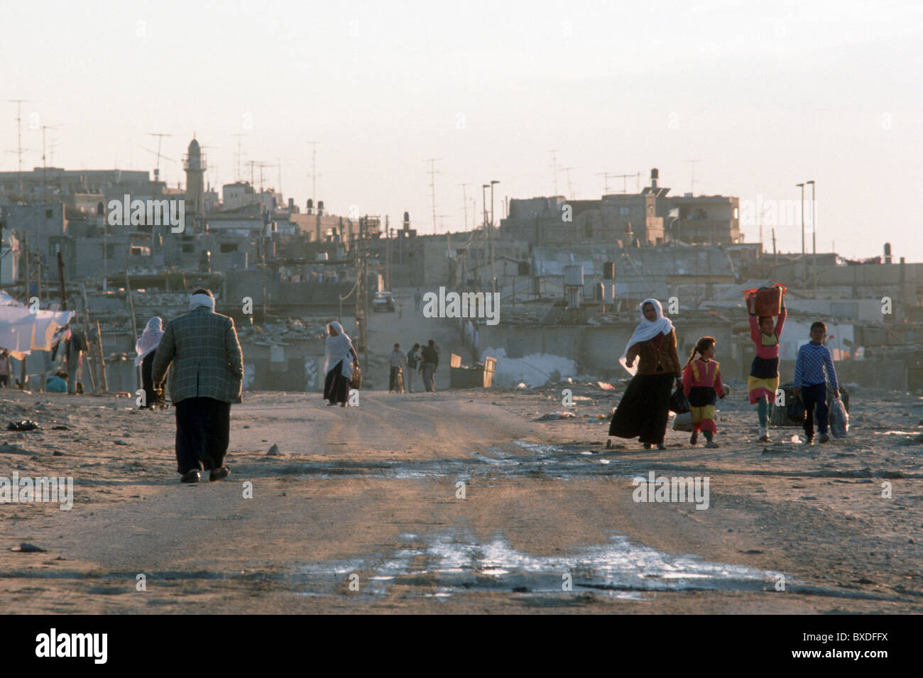 PALESTINE. PEOPLE WALKING ALONG A STREET IN THE BEACH CAMP IN GAZA ...