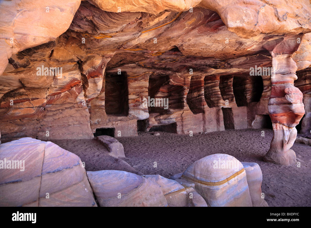 Color rock cave in Petra, Jordan Stock Photo - Alamy