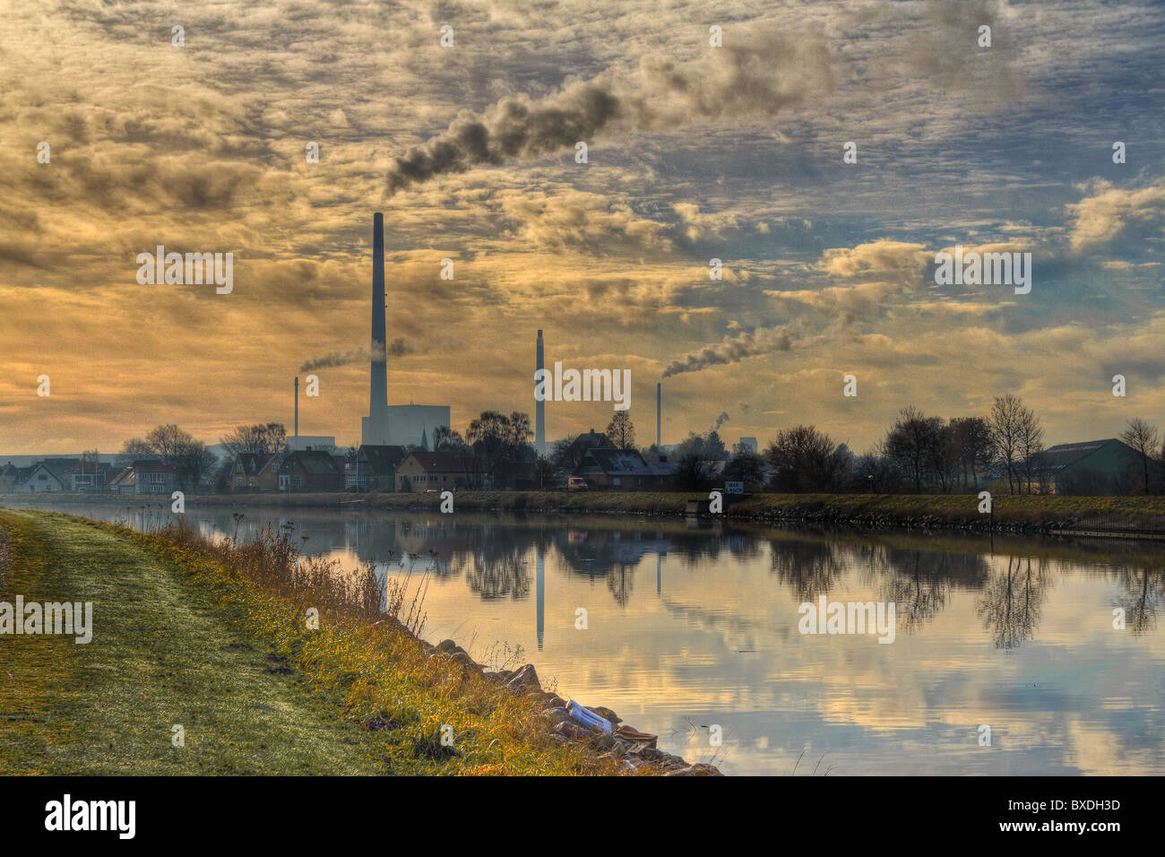View to a power plant across a channel with reflections from the ...