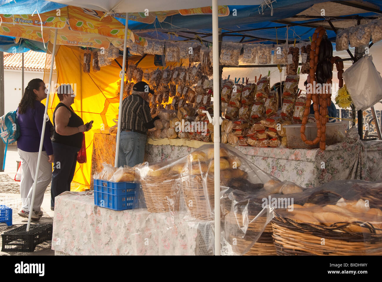 Shoppers buying bread at market Stock Photo - Alamy