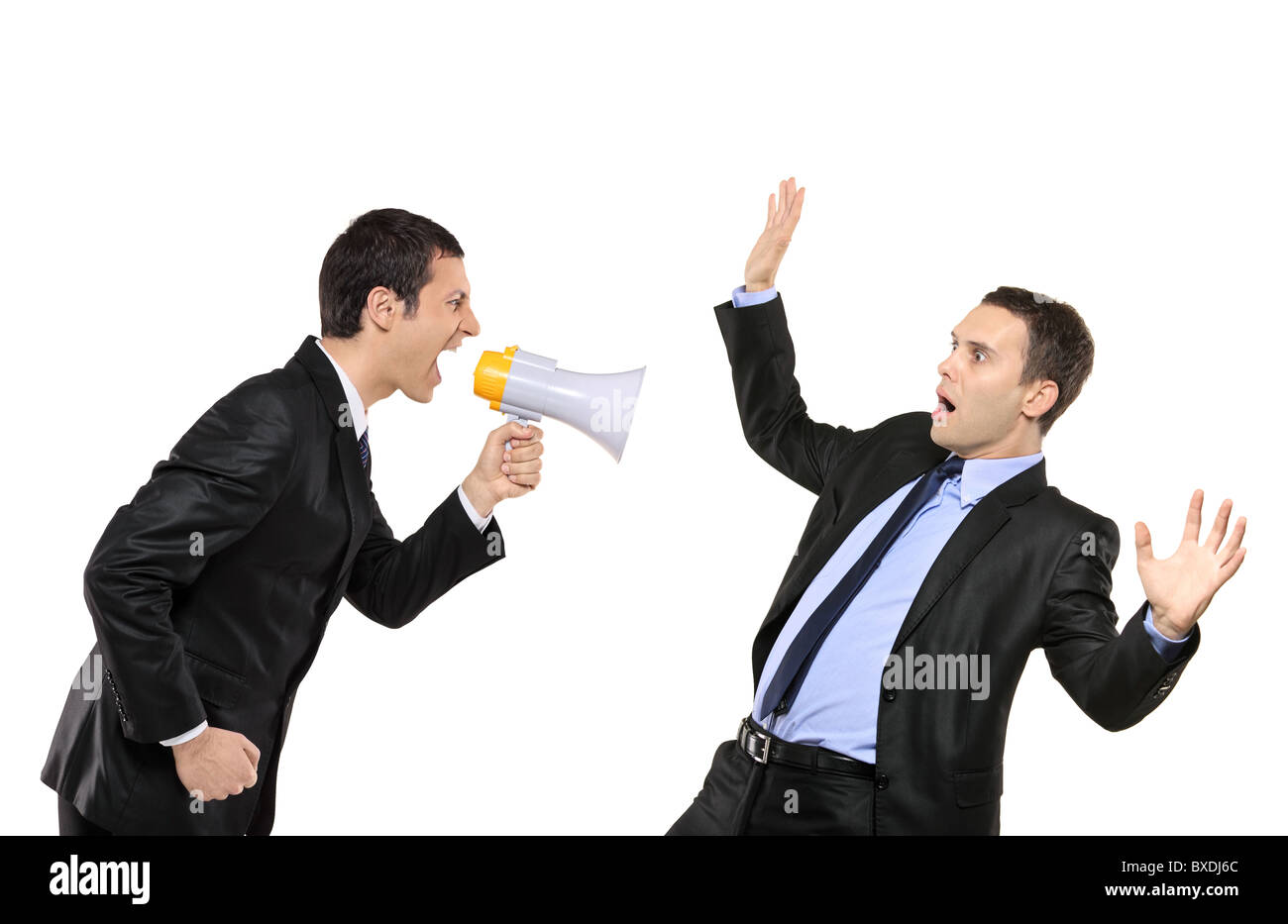 Angry businessman yelling via megaphone to another businessman Stock ...