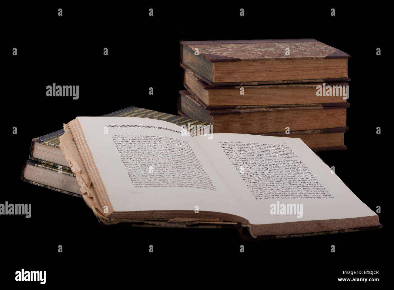 Old style vintage books, isolated on black Stock Photo - Alamy