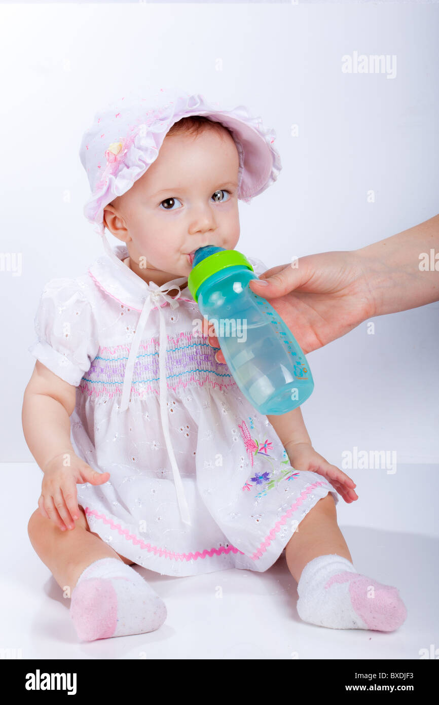 Baby in studio against a white background Stock Photo - Alamy