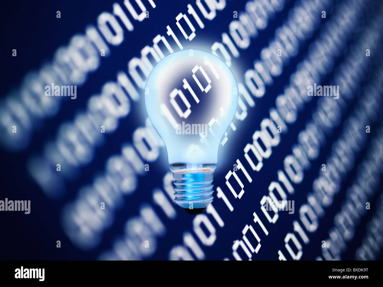 Light bulb in front of computer code Stock Photo - Alamy
