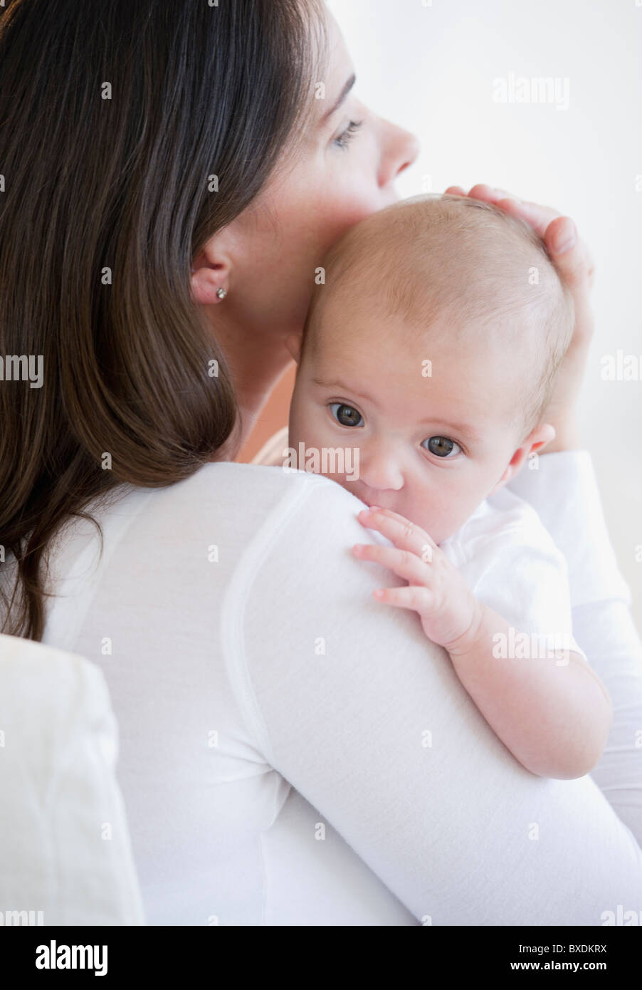 Mother holding her baby Stock Photo - Alamy