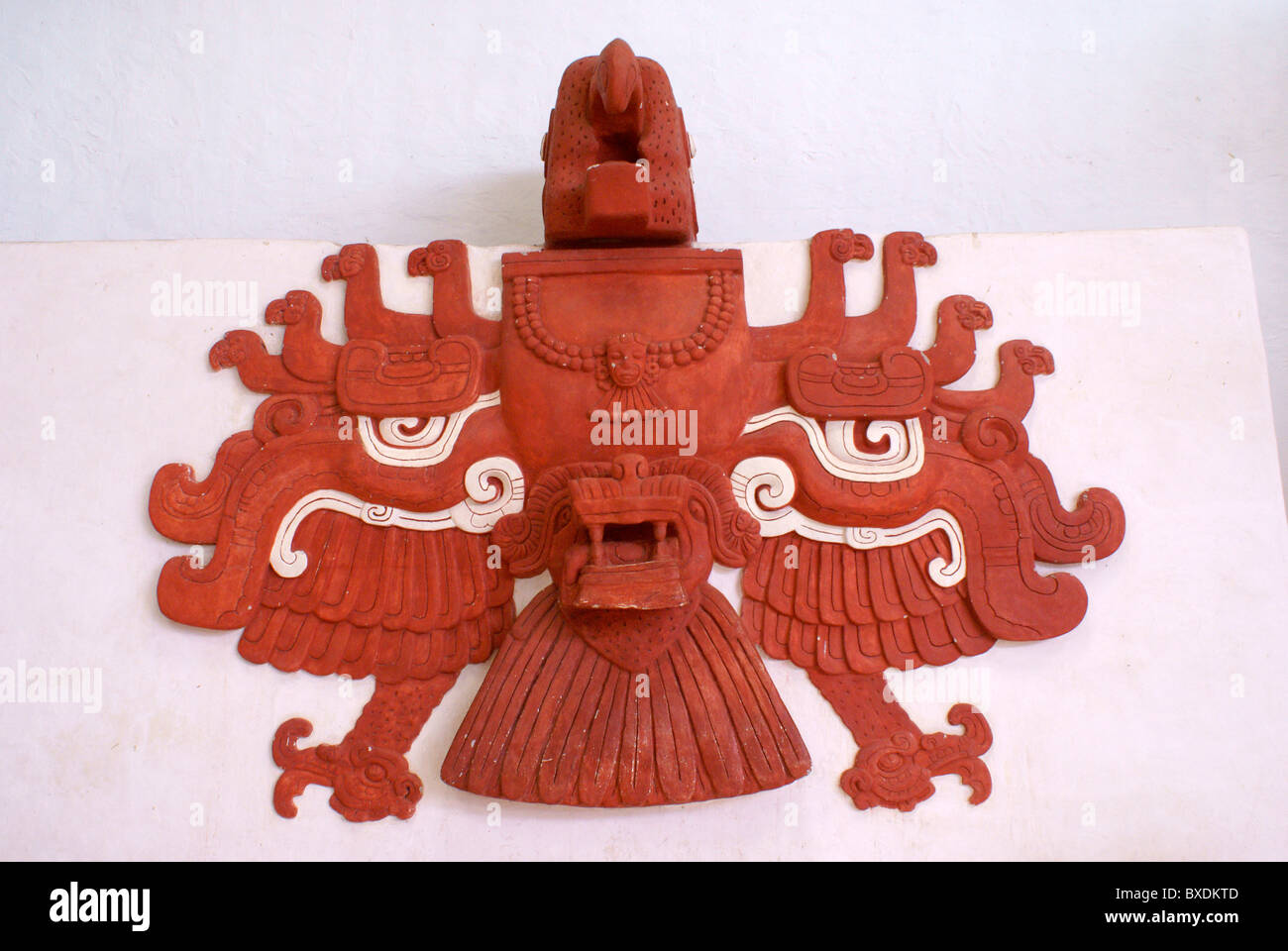 Replica of a red stucco macaw sculpture from Ballcourt I at the Mayan ...
