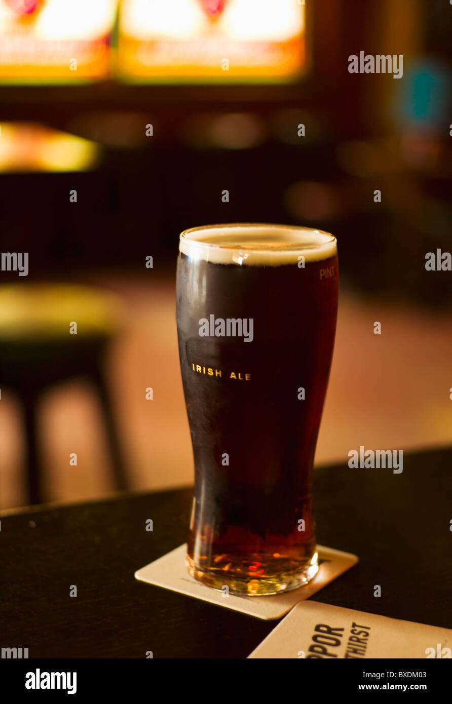 Glass of Irish ale in pub Stock Photo - Alamy