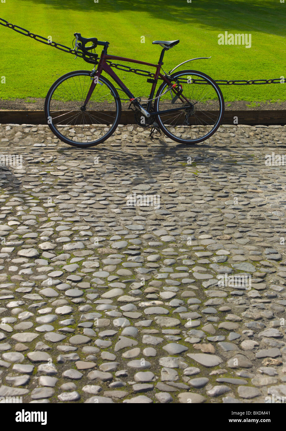 Bicycle on cobblestone path Stock Photo - Alamy