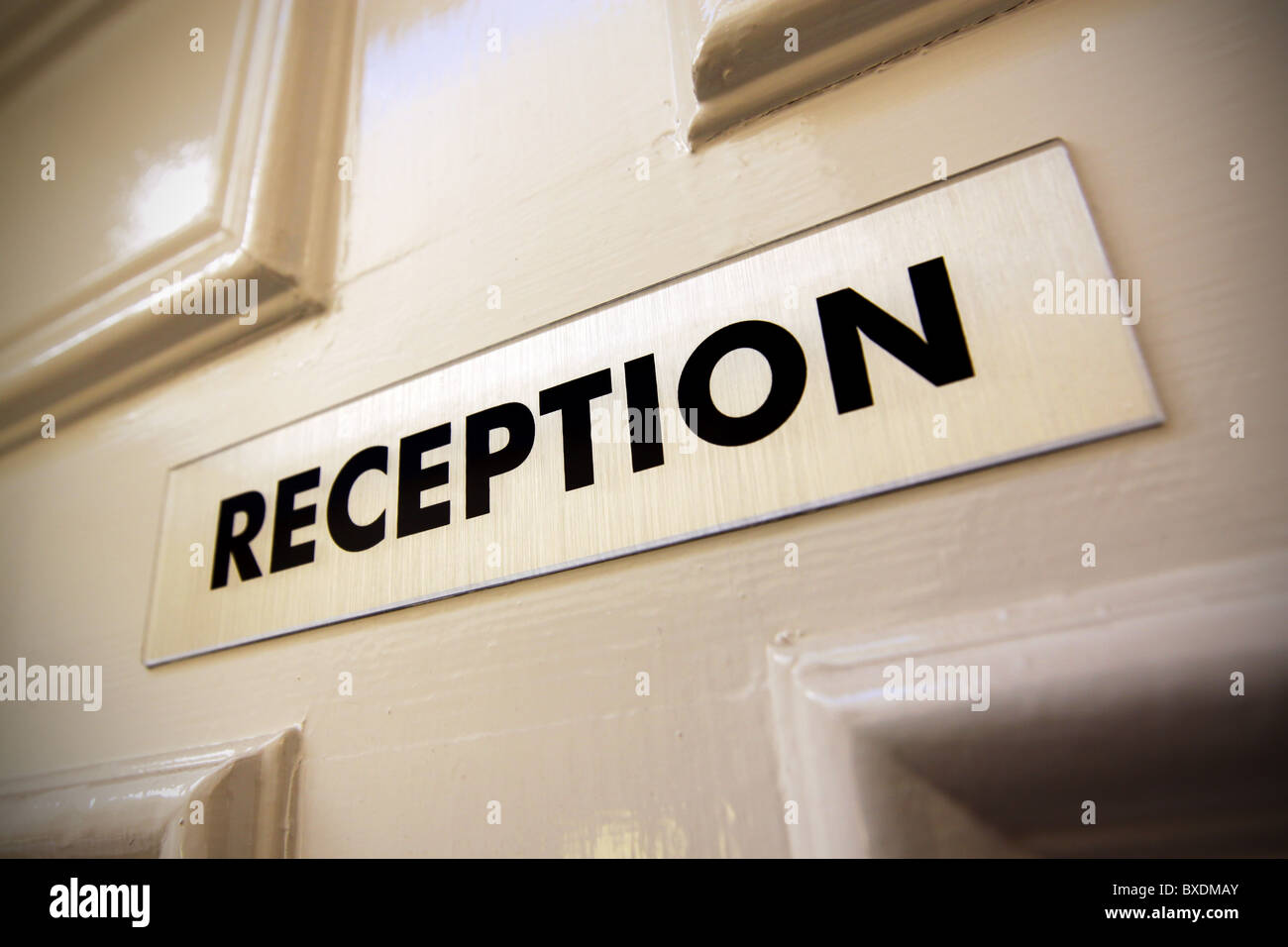 Reception sign on panelled office door Stock Photo - Alamy