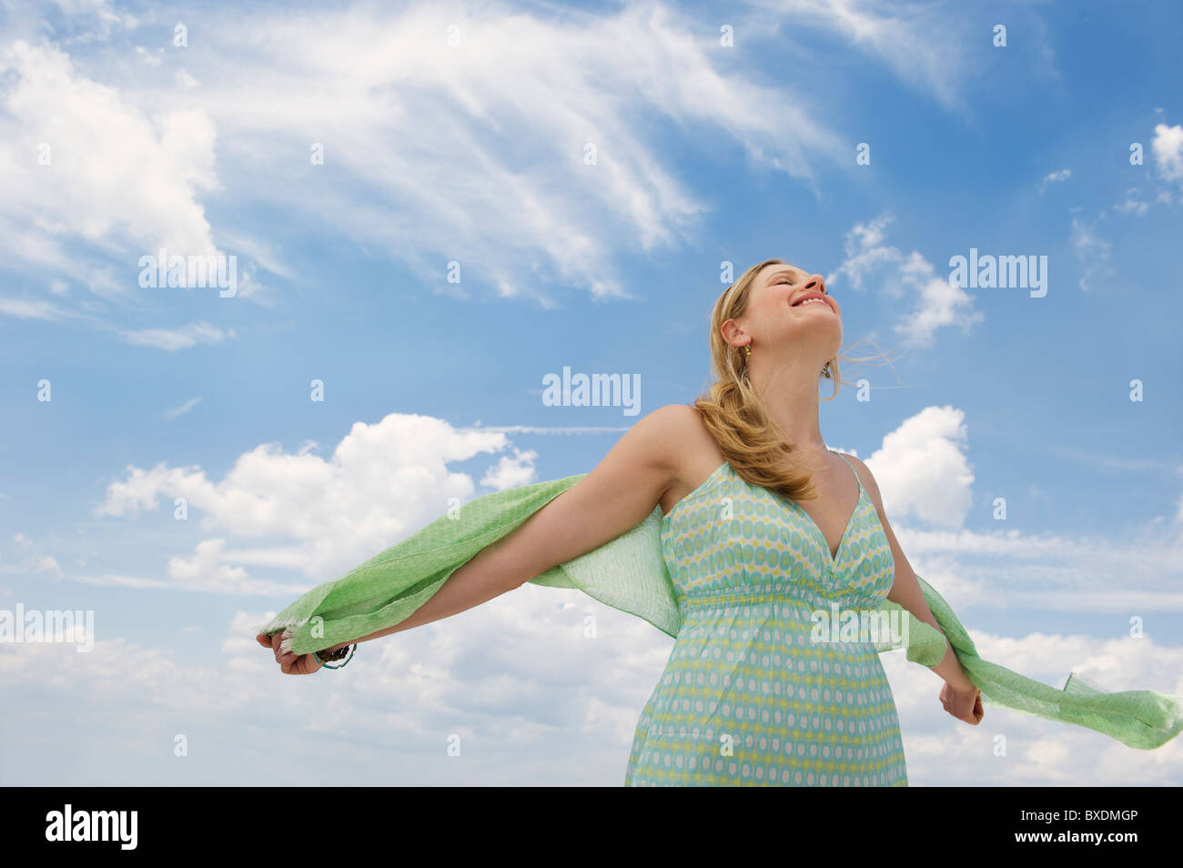 Blond woman walking outside Stock Photo - Alamy